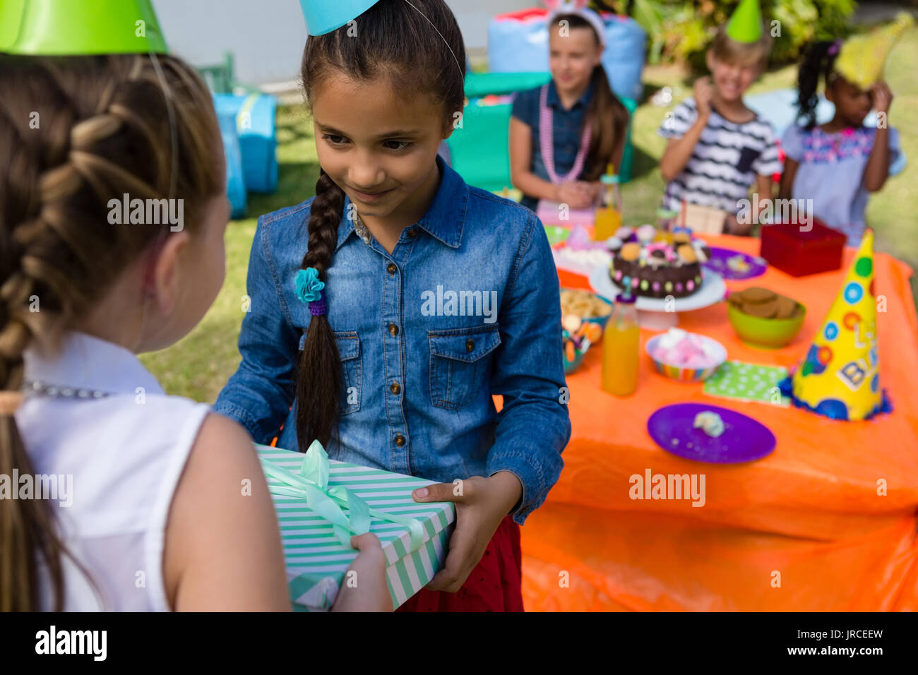 Friend giving gift in hi-res stock photography and images - Alamy
