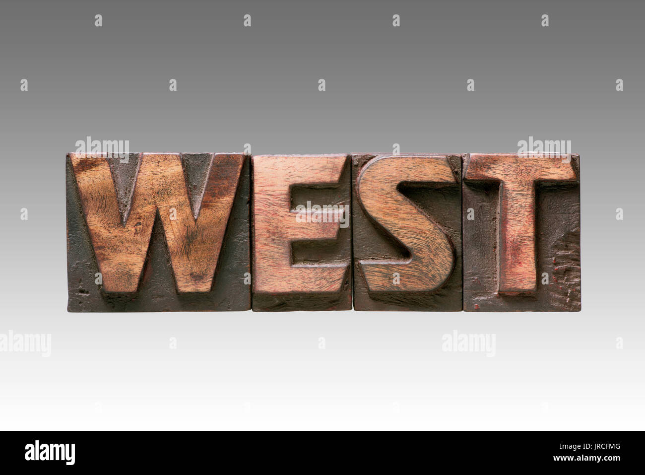 West word assembled from vintage wooden typography letters isolated on ...