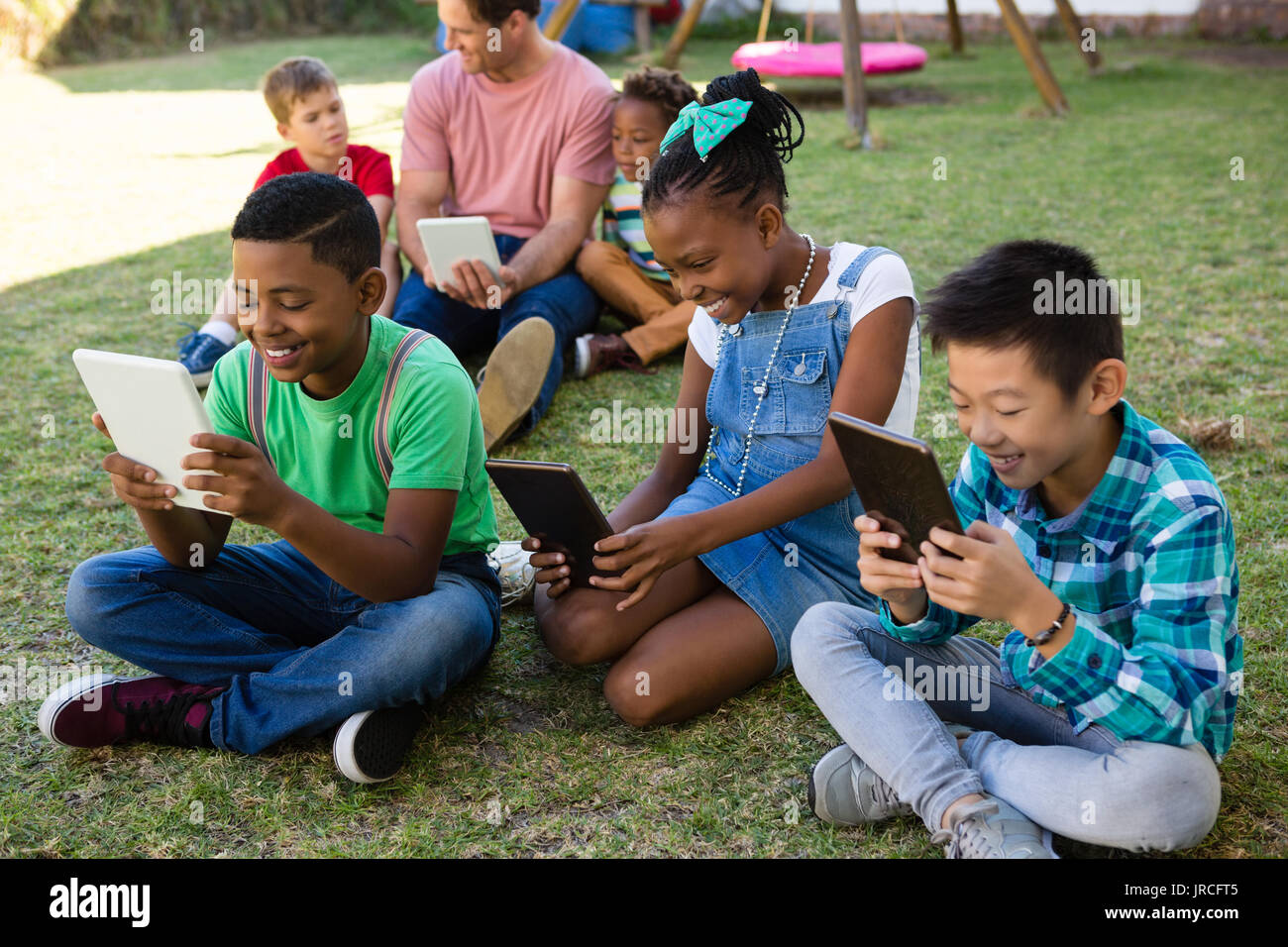 Children sitting cross legged hi-res stock photography and images - Alamy