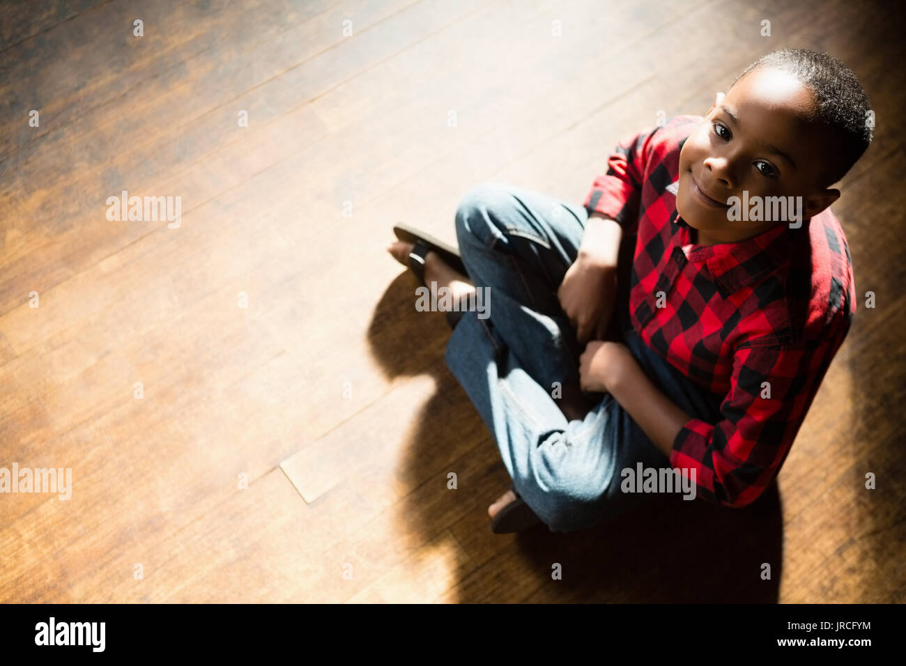 Portrait happy boy sitting home hi-res stock photography and images - Alamy