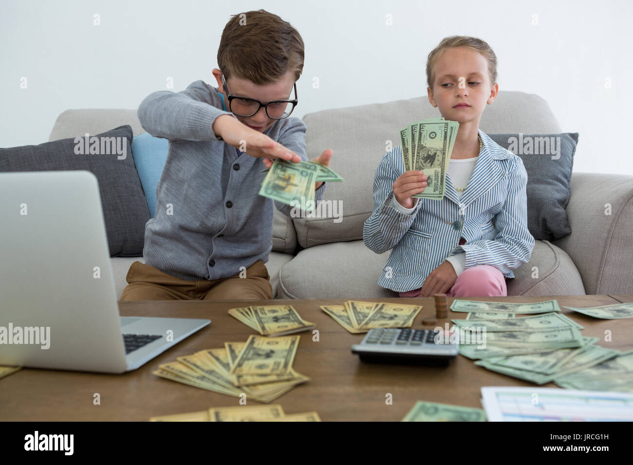 Boy girl counting money hi-res stock photography and images - Alamy