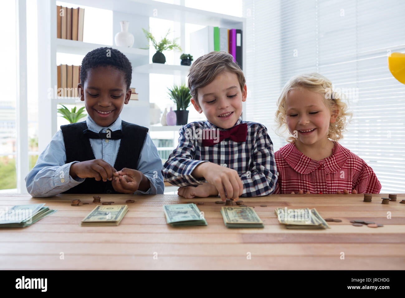 Boy girl counting money hi-res stock photography and images - Alamy