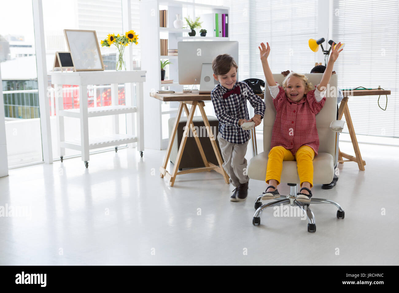 Girl pushing chair hi-res stock photography and images - Alamy