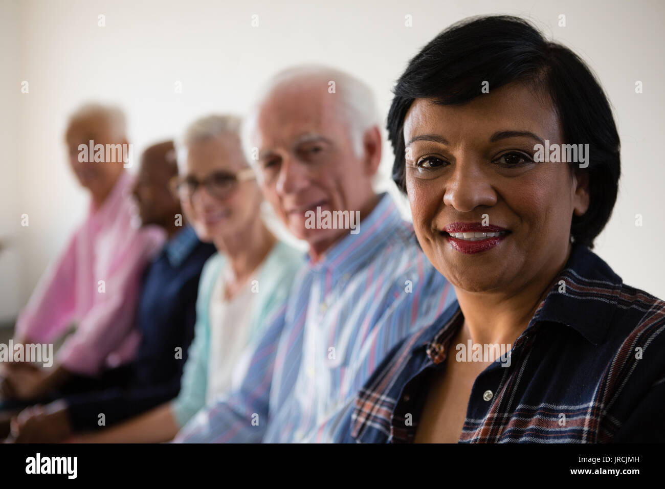 Portrait of smiling senior friends in art class Stock Photo - Alamy