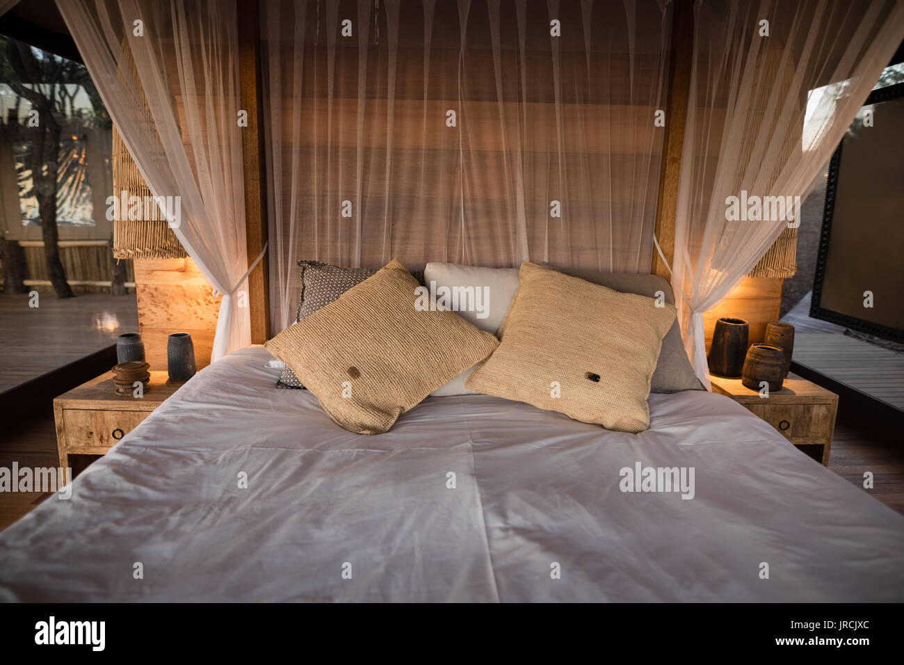 View of empty canopy bed Stock Photo - Alamy