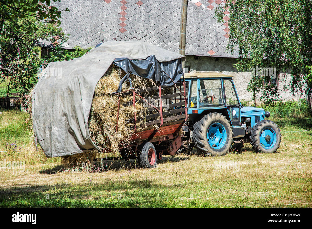 Old tractor with hay. Agricultural scene. Seasonal rural scene Stock ...