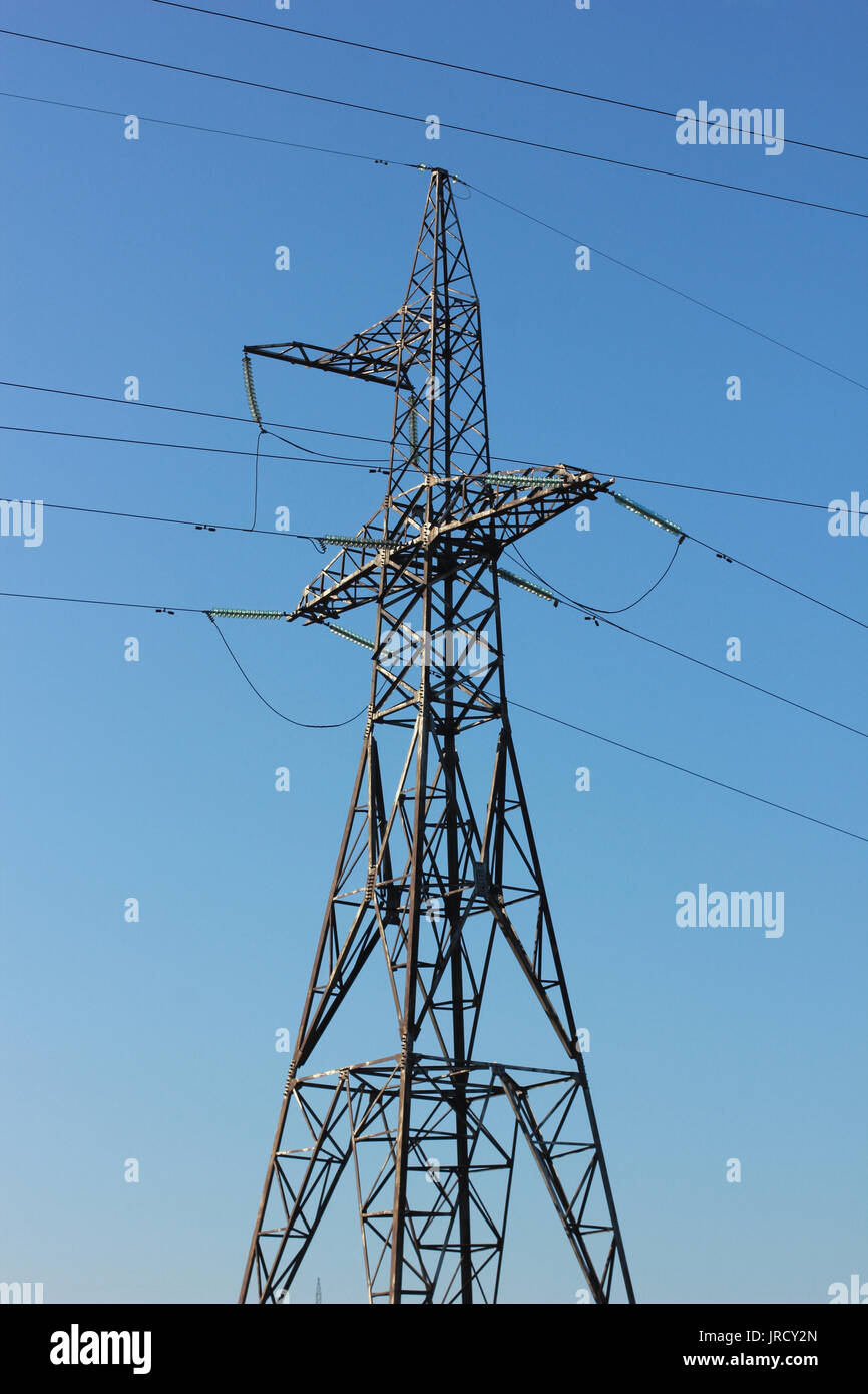 high-voltage transmission cables on electric poles Stock Photo - Alamy