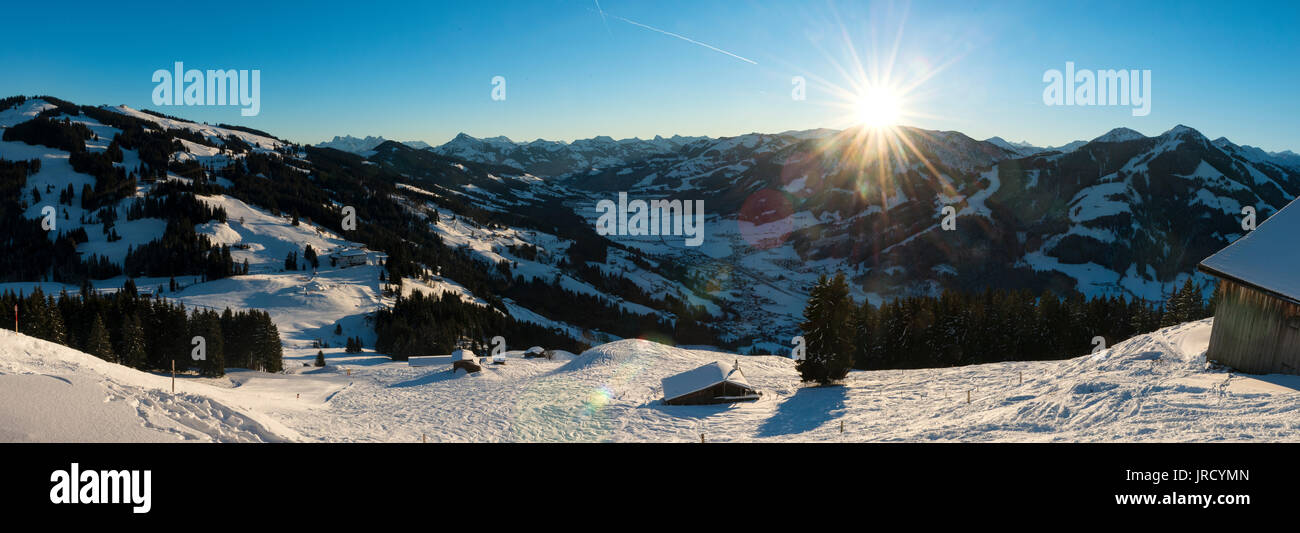 View to the Brixental with sunshine in the winter, morning sun, SkiWelt ...