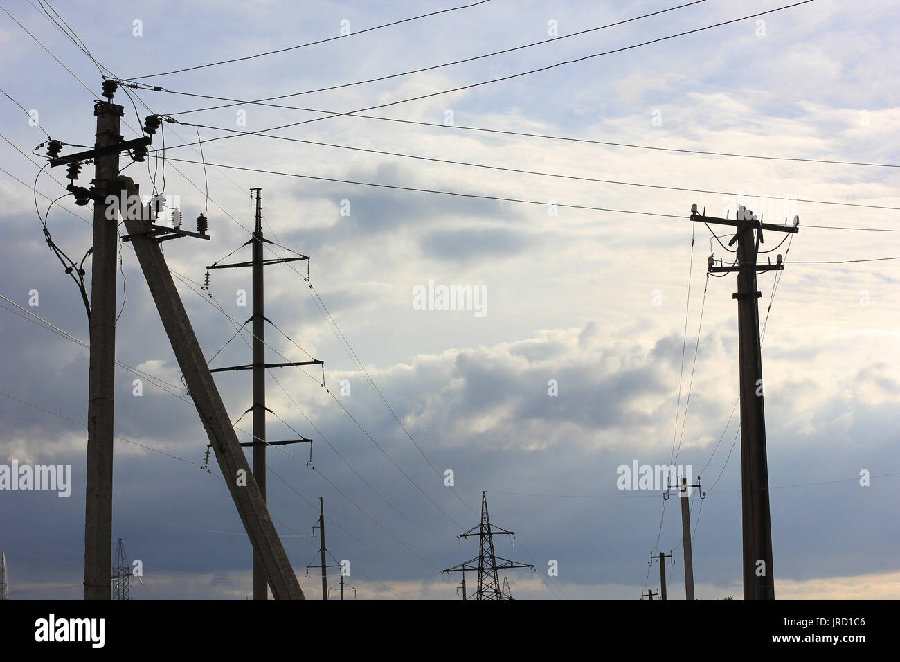 high-voltage transmission cables on electric poles Stock Photo - Alamy
