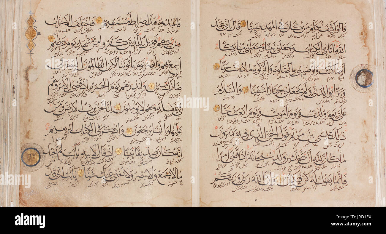 Page of an old bilingual Qur'an written in Arabic and Persian in the ...