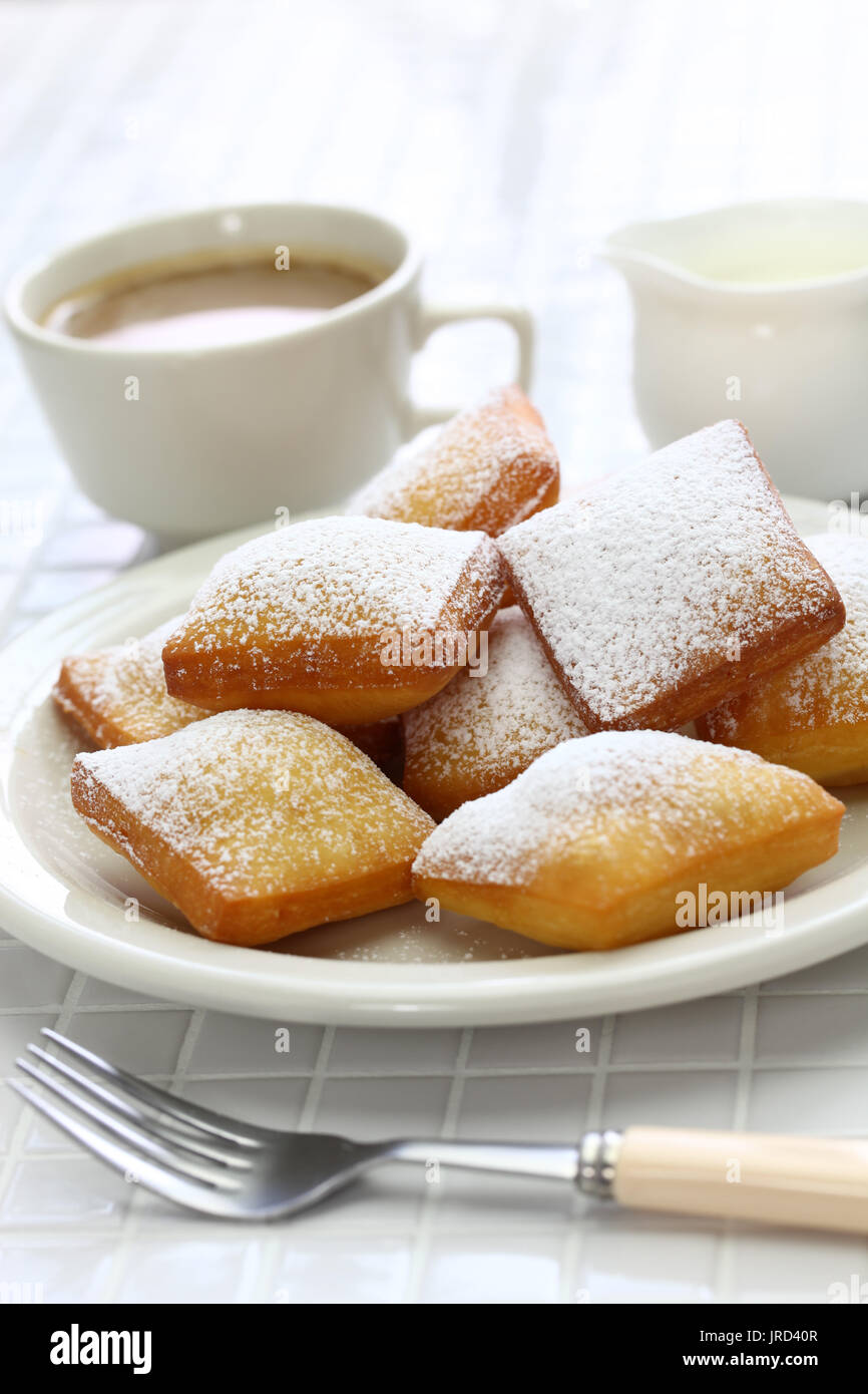 homemade new orleans beignet donuts and a cup of coffee Stock Photo - Alamy