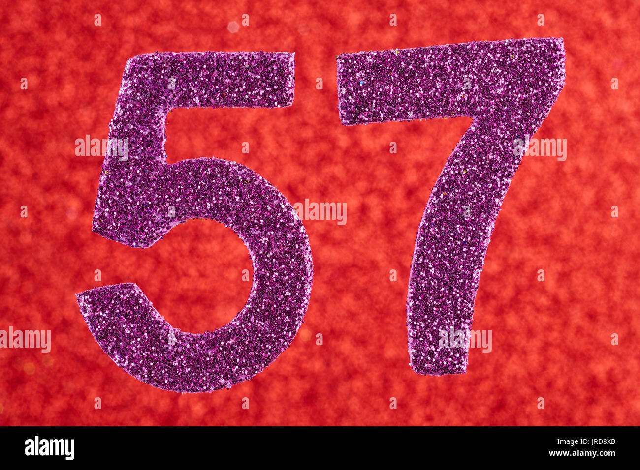 Number fifty-seven purple color over a red background. Anniversary ...