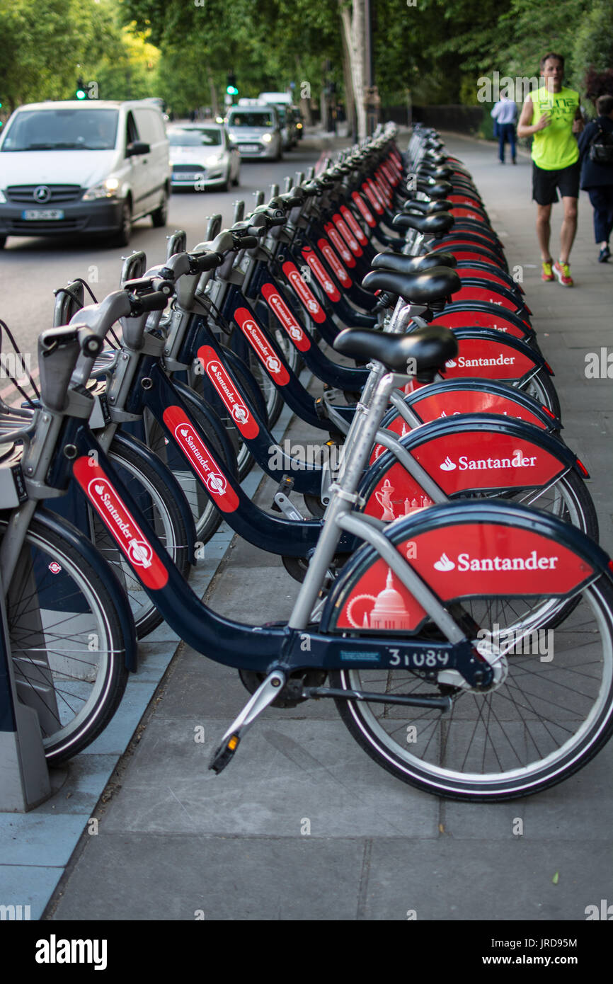 line of Boris bikes London also runner Stock Photo - Alamy