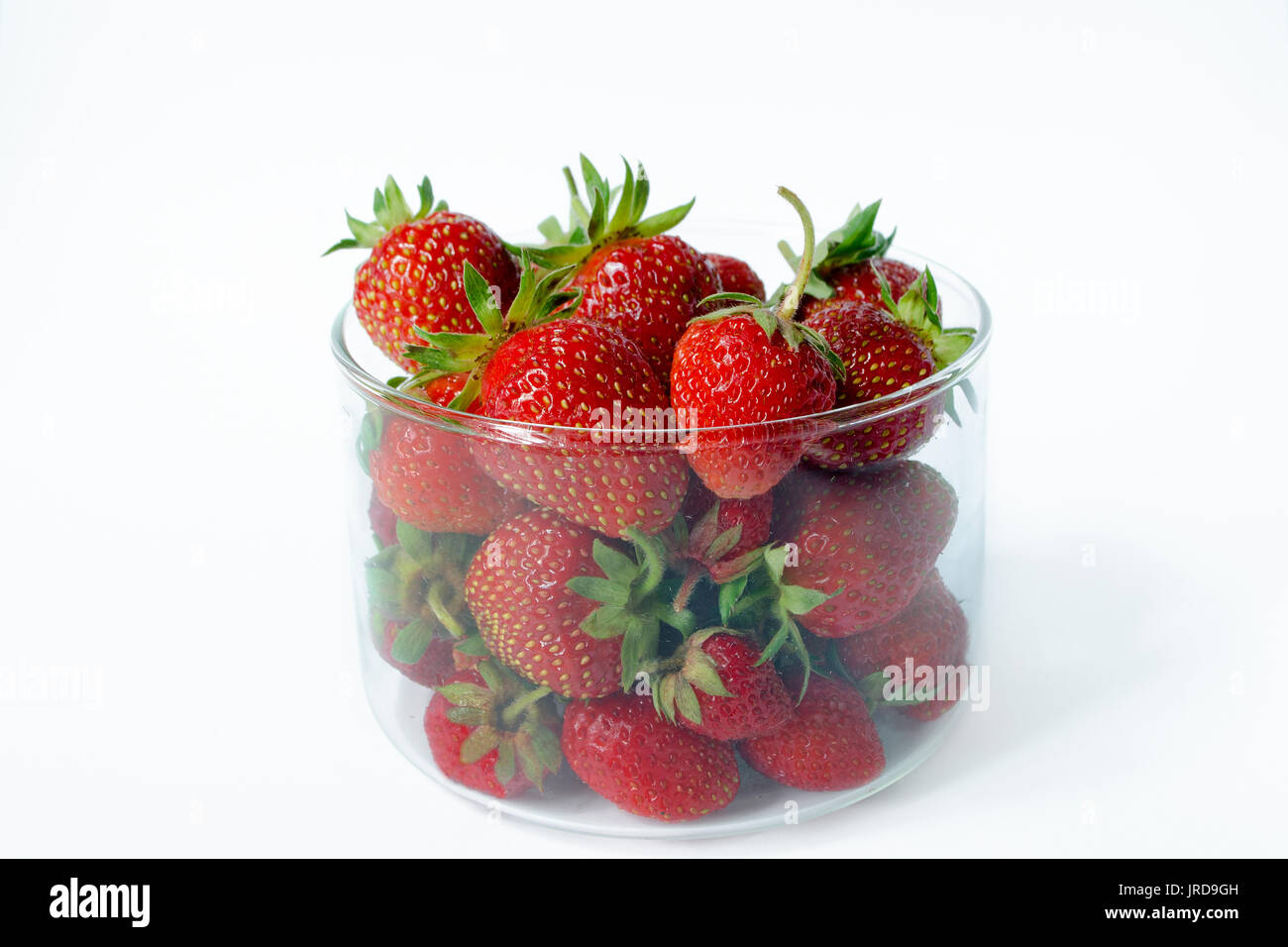 Strawberries in a glass on a white background. Side view Stock Photo ...