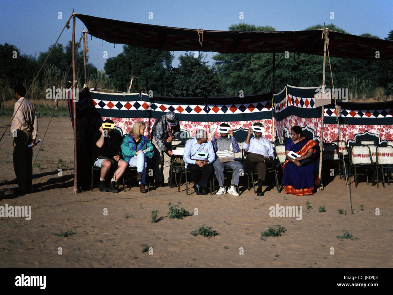 People observing total solar eclipse in 1995 in India with safe viewers ...