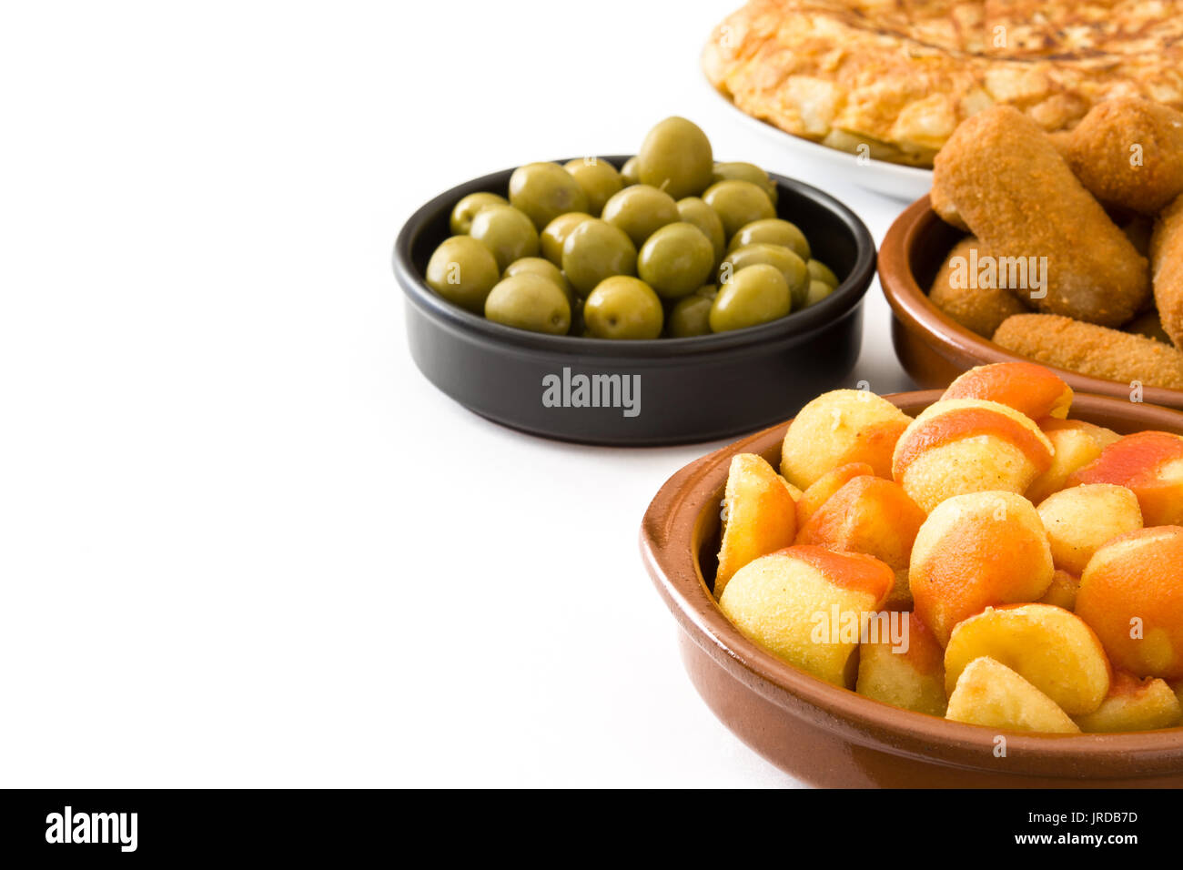 Traditional spanish tapas. Croquettes, olives, ham and patatas bravas ...