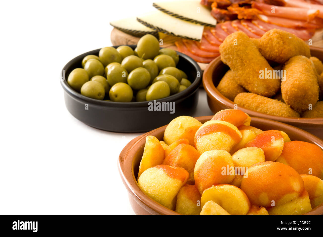 Traditional spanish tapas. Croquettes, olives, ham and patatas bravas ...