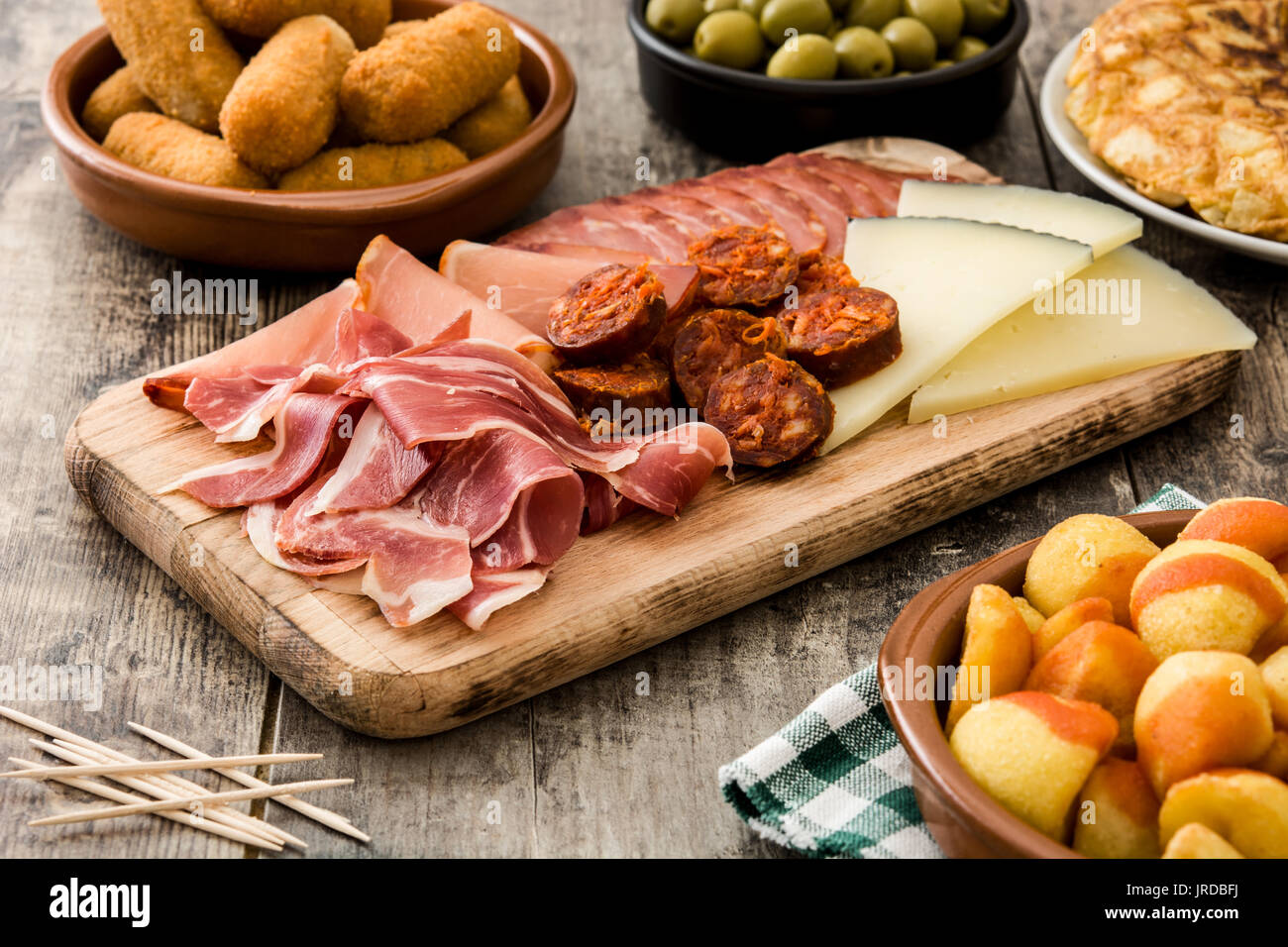 Traditional spanish tapas. Croquettes, olives, omelette, ham and ...