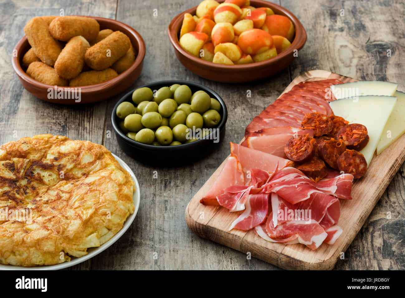 Traditional spanish tapas. Croquettes, olives, omelette, ham and ...