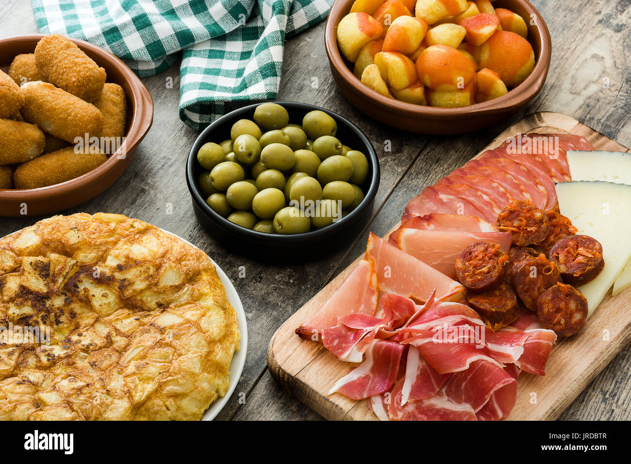 Traditional spanish tapas. Croquettes, olives, omelette, ham and ...