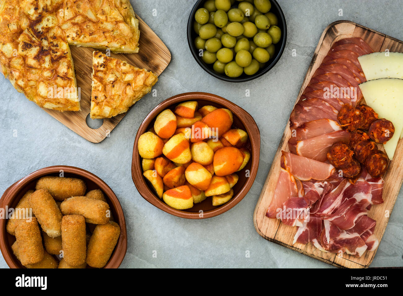 Traditional spanish tapas. Croquettes, olives, omelette, ham and ...