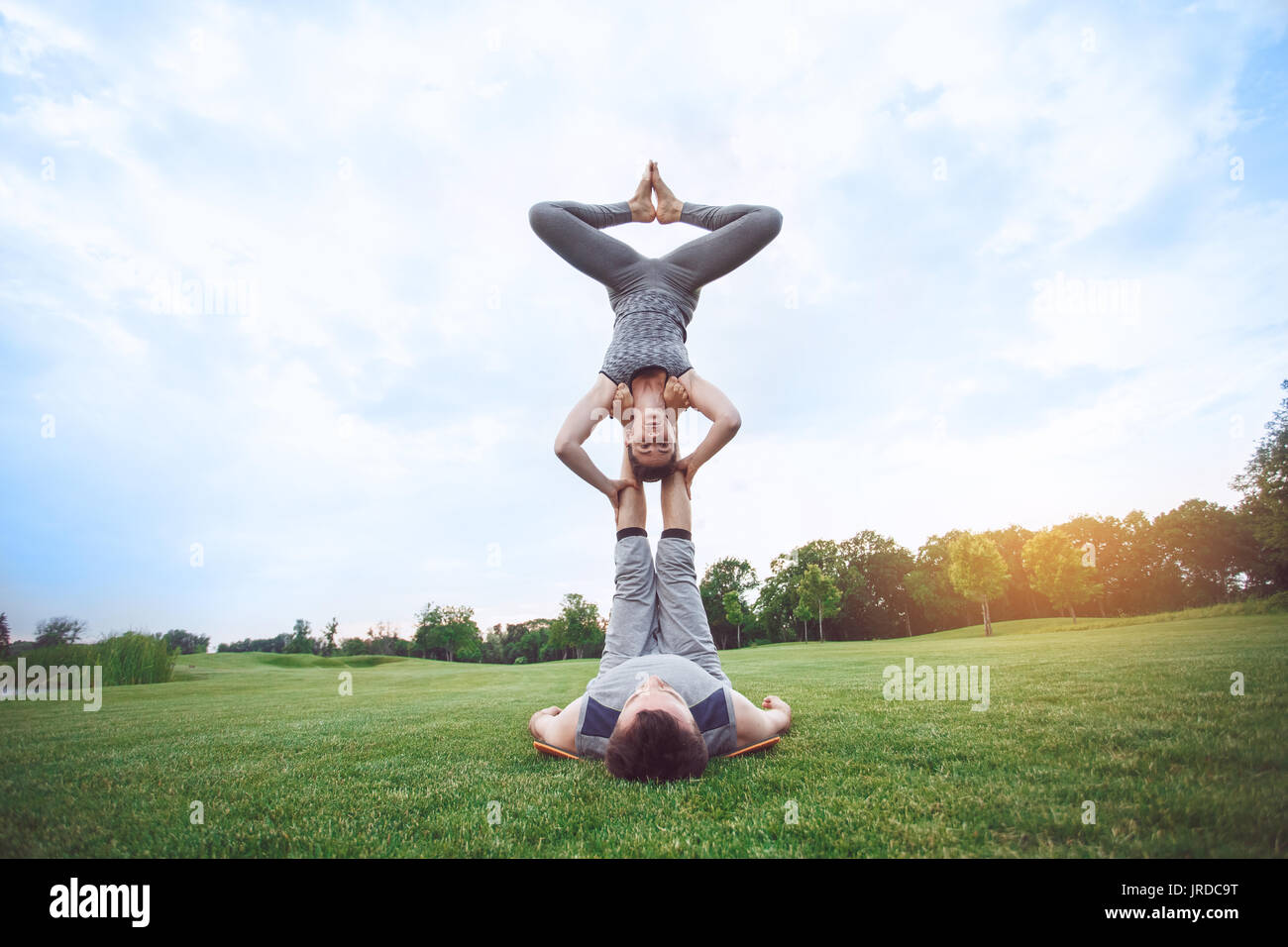 Acro yoga two people practice hi-res stock photography and images - Alamy