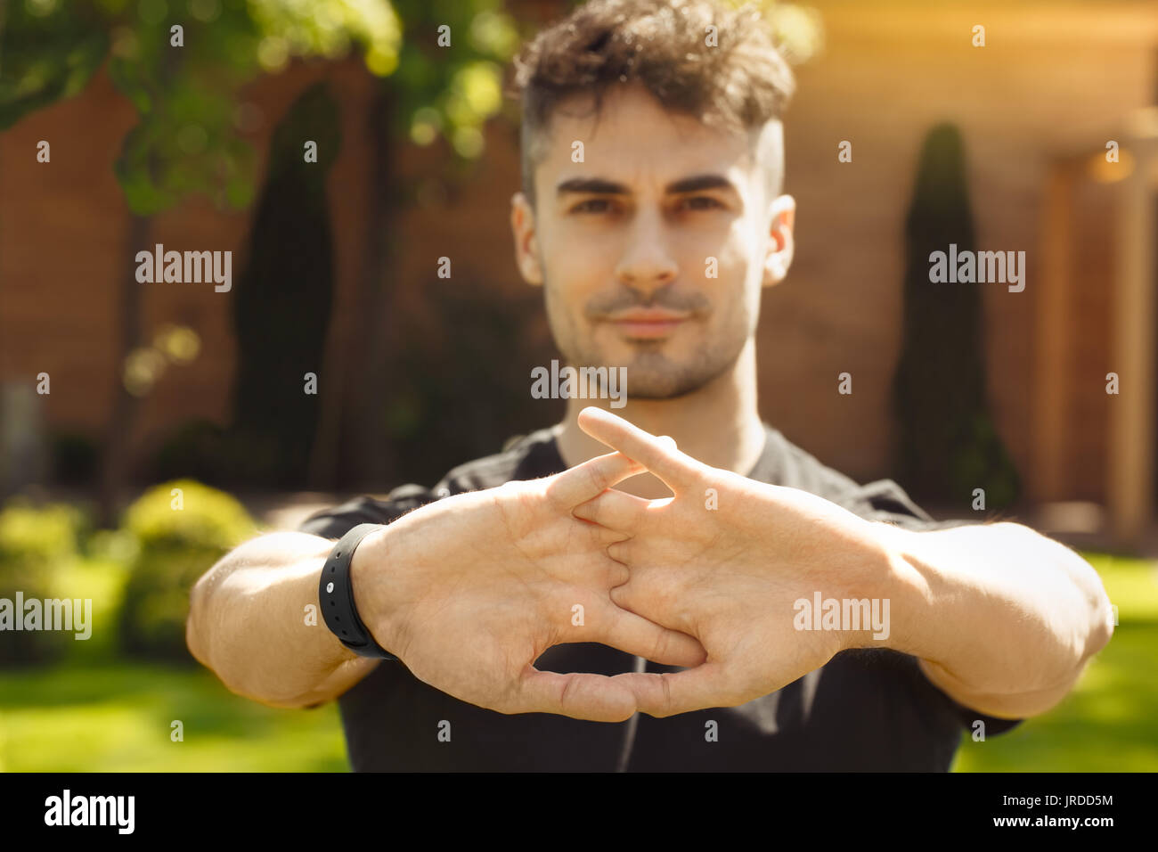 Serious handsome man stretching hands hi-res stock photography and ...