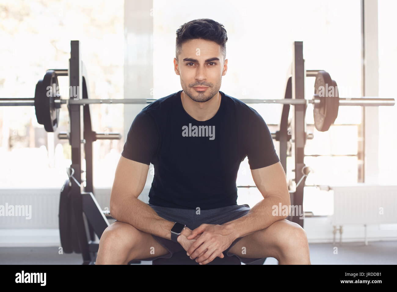 Serious man sitting in gym hi-res stock photography and images - Alamy
