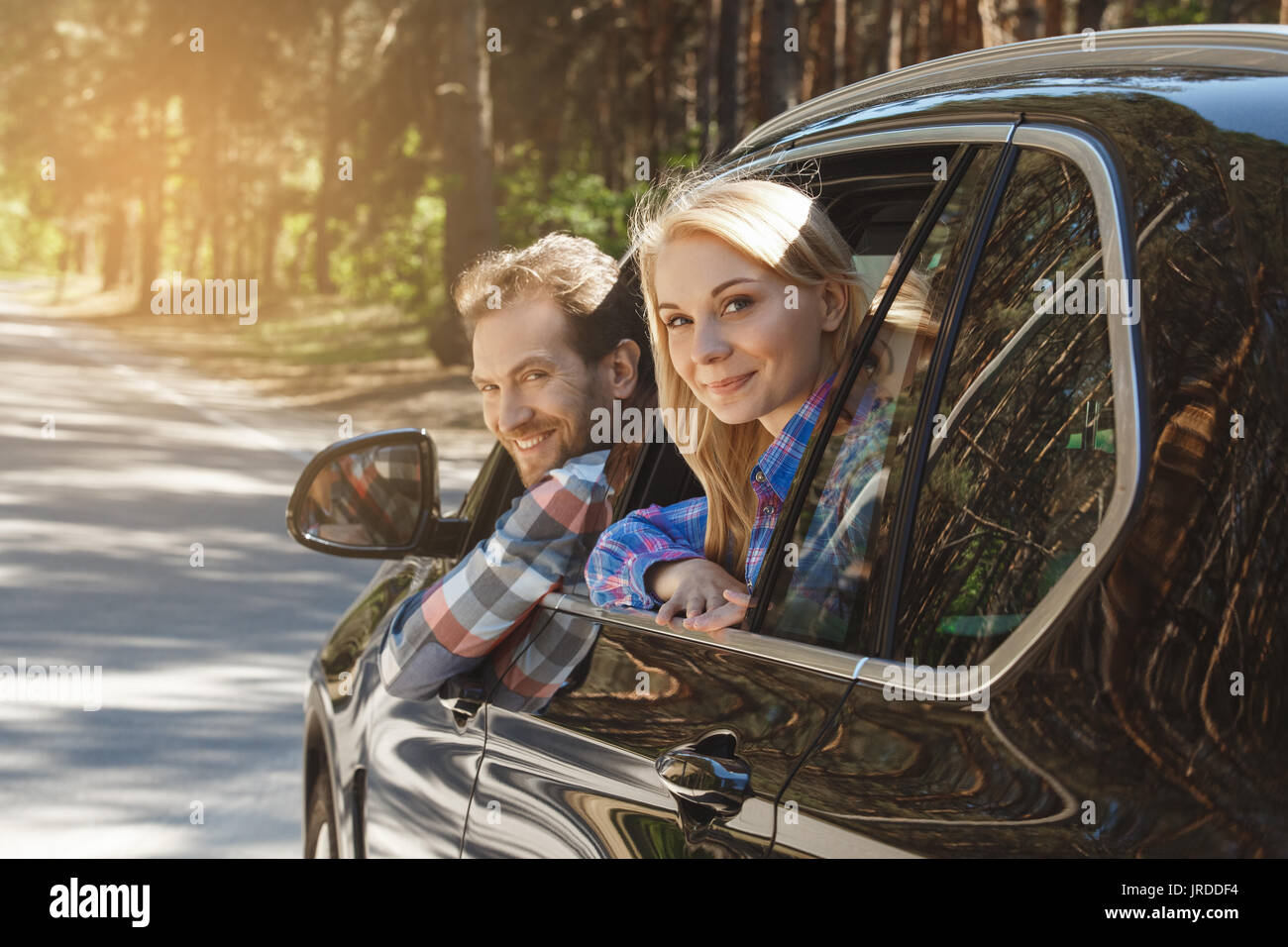 Travel by car family ride together couple lean out of the window Stock ...