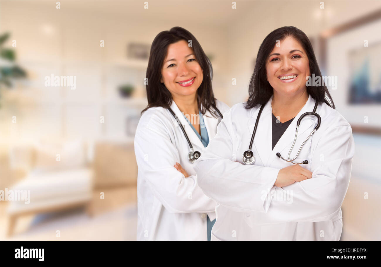 Female Hispanic Doctors or Nurses Standing in an Office Stock Photo - Alamy