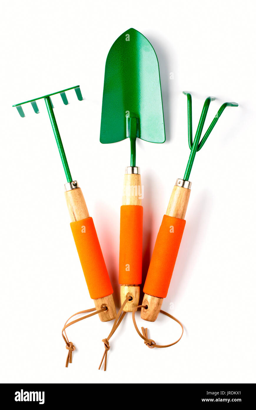 garden trowel, fork and rake on a white background Stock Photo - Alamy
