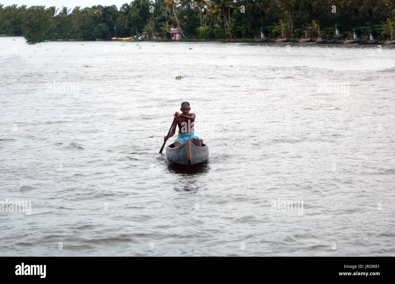 Fisherman in the sea Stock Photo - Alamy