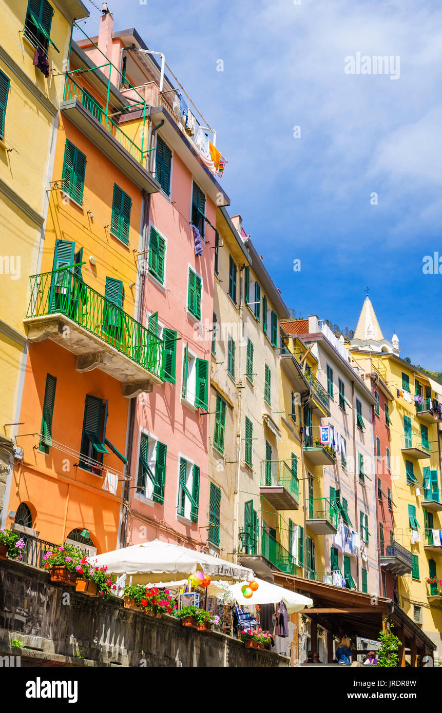 Narrow street and colorful houses in Riomaggiore, Cinque Terre, Liguria ...