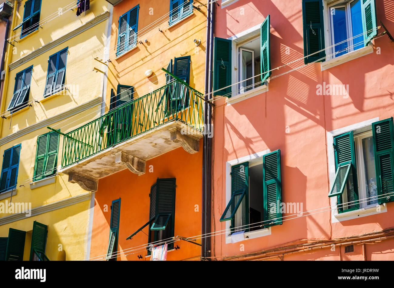 Narrow street and colorful houses in Riomaggiore, Cinque Terre, Liguria ...