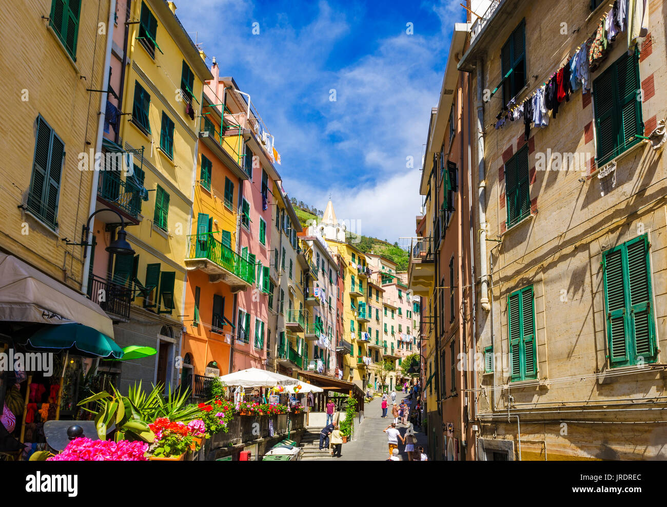 Narrow street and colorful houses in Riomaggiore, Cinque Terre, Liguria ...