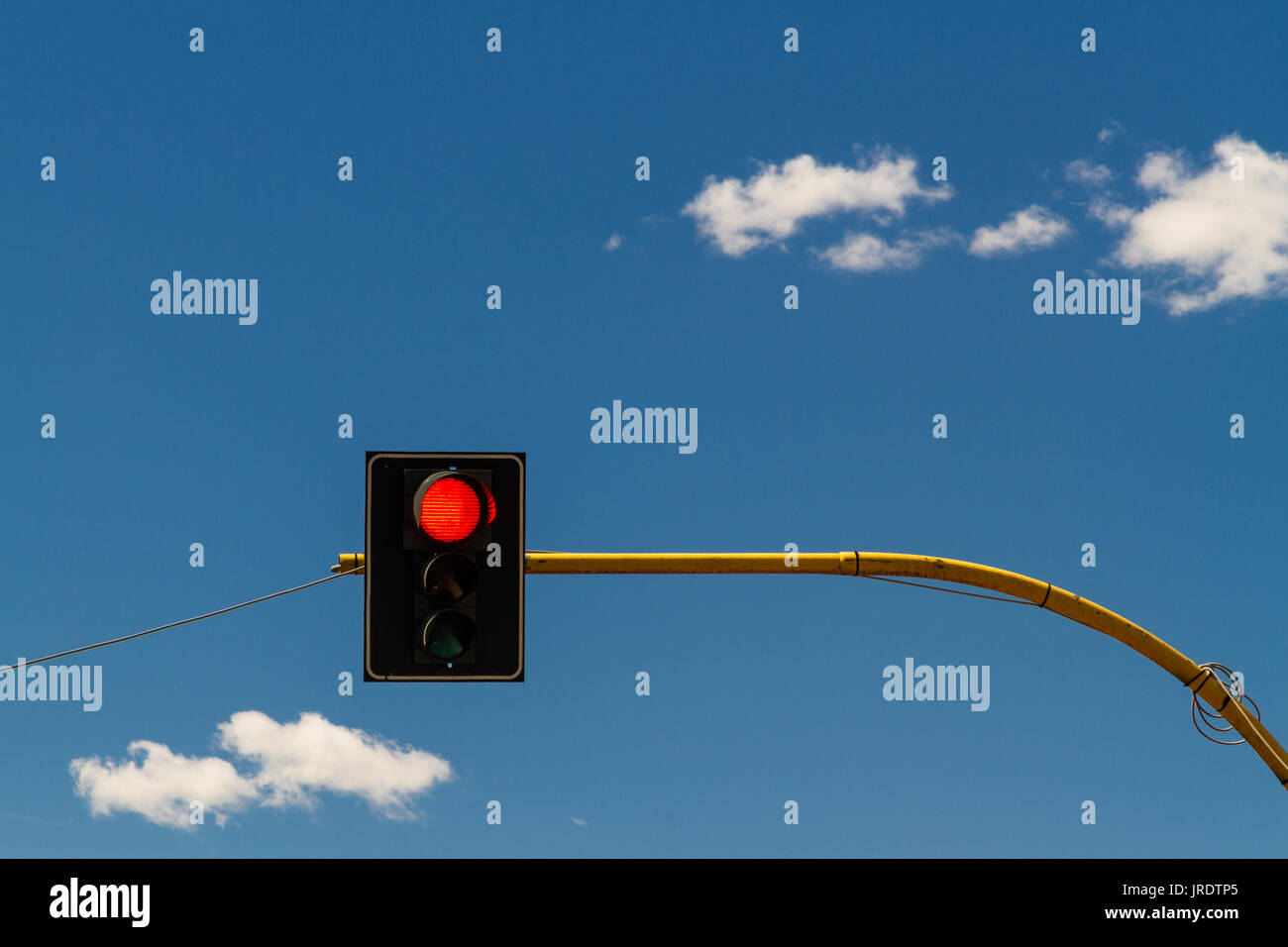 Florence, Italy, traffic light with red light, against blue sky and ...