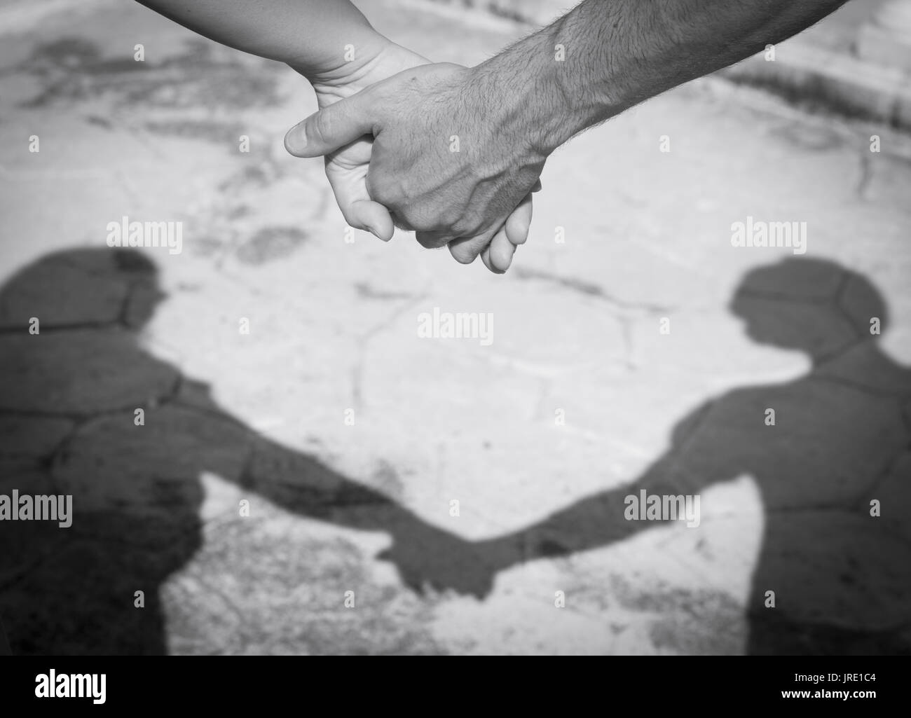 Intertwined hands and arms hi-res stock photography and images - Alamy