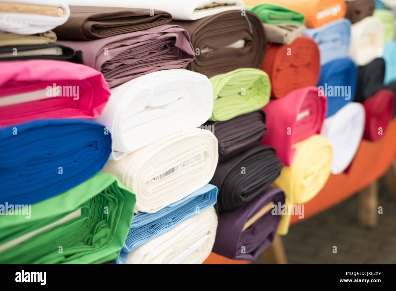 textile rolls, colorful fabric samples on market Stock Photo - Alamy