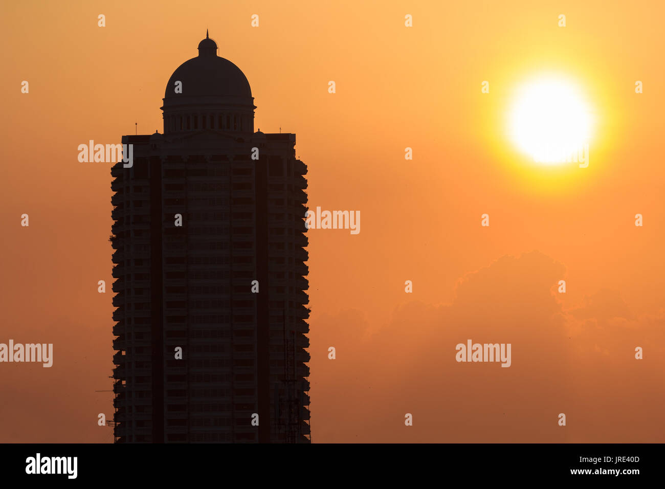high building with the sun Stock Photo - Alamy