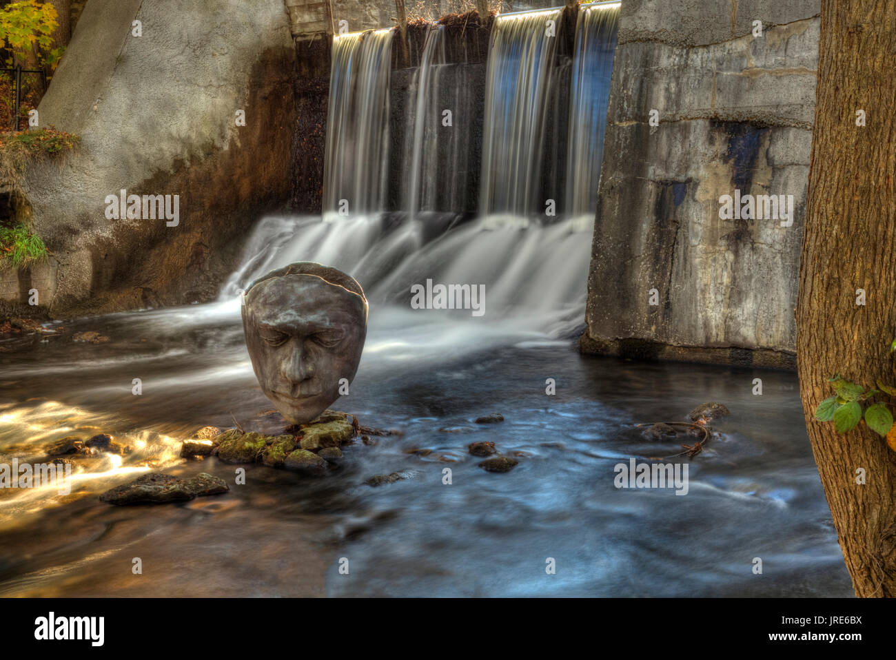 River with face sculpture in water Stock Photo - Alamy