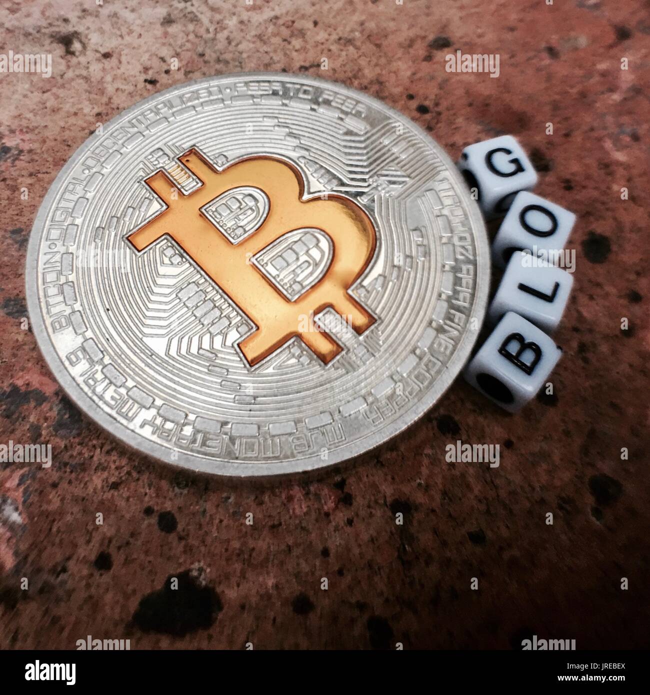 Digital currency physical metal bitcoin coin with white square letters ...