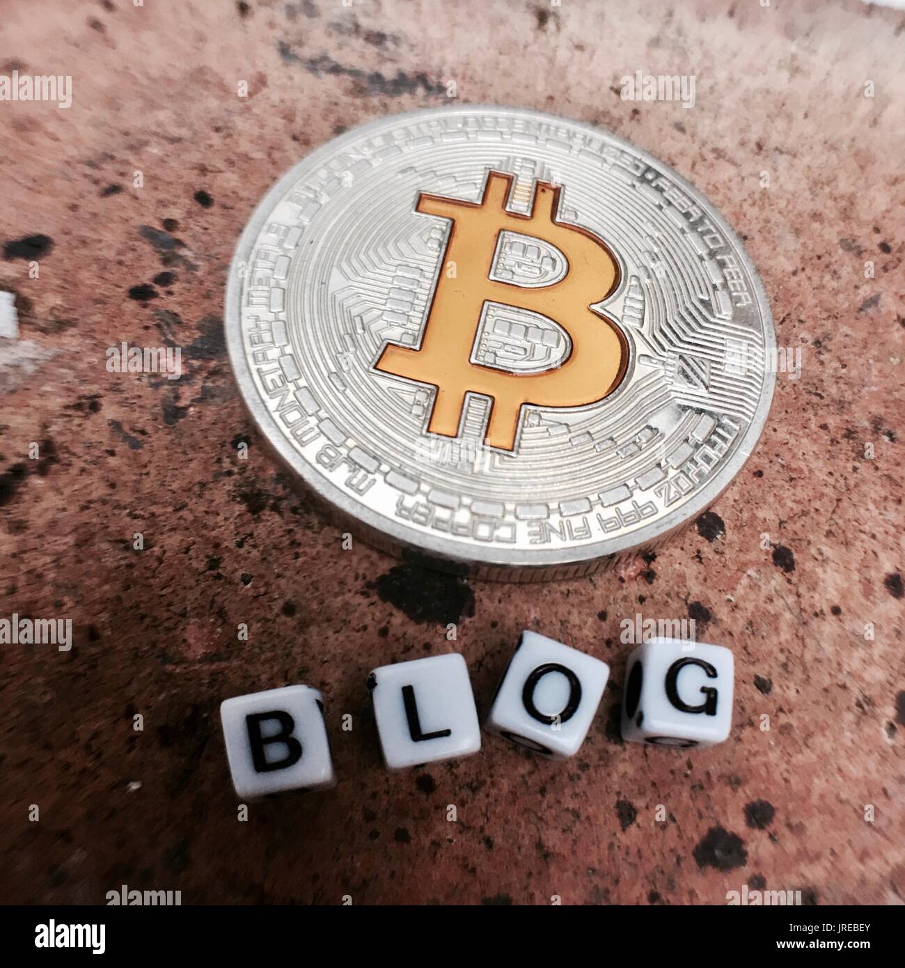 Digital currency physical metal bitcoin coin with white square letters ...