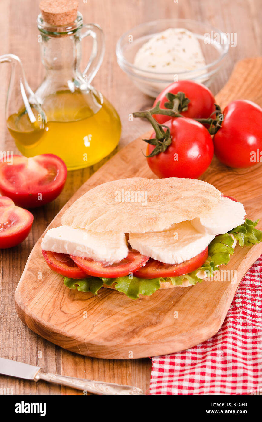Puccia bread with mozzarella and tomato Stock Photo - Alamy