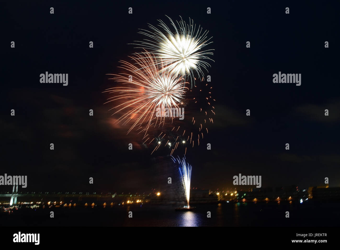 Urban landscape of Yokohama in Japan during summer fireworks. Fireworks ...