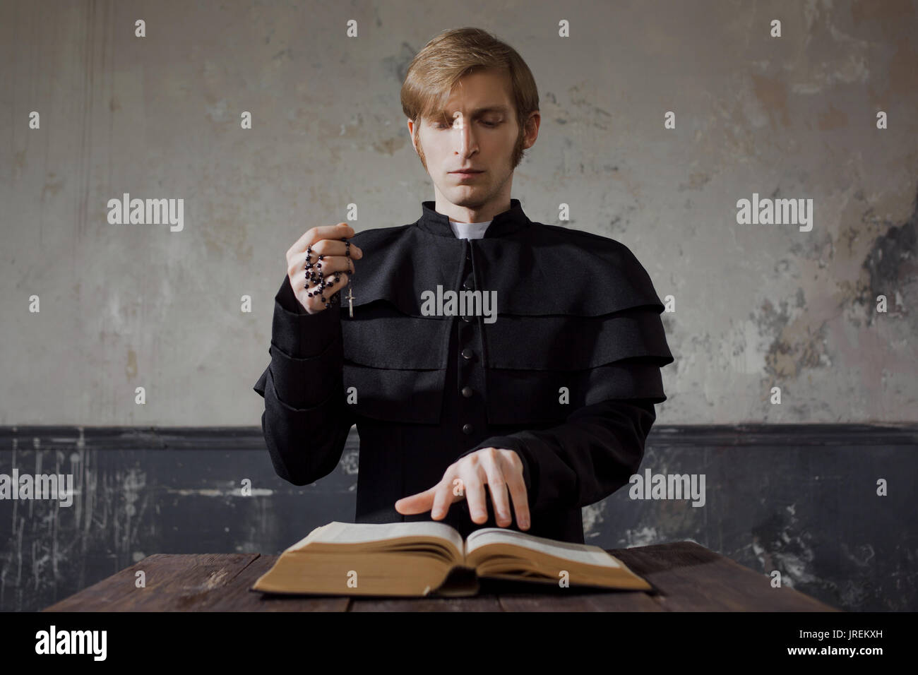 Portrait of handsome young catholic priest Stock Photo - Alamy