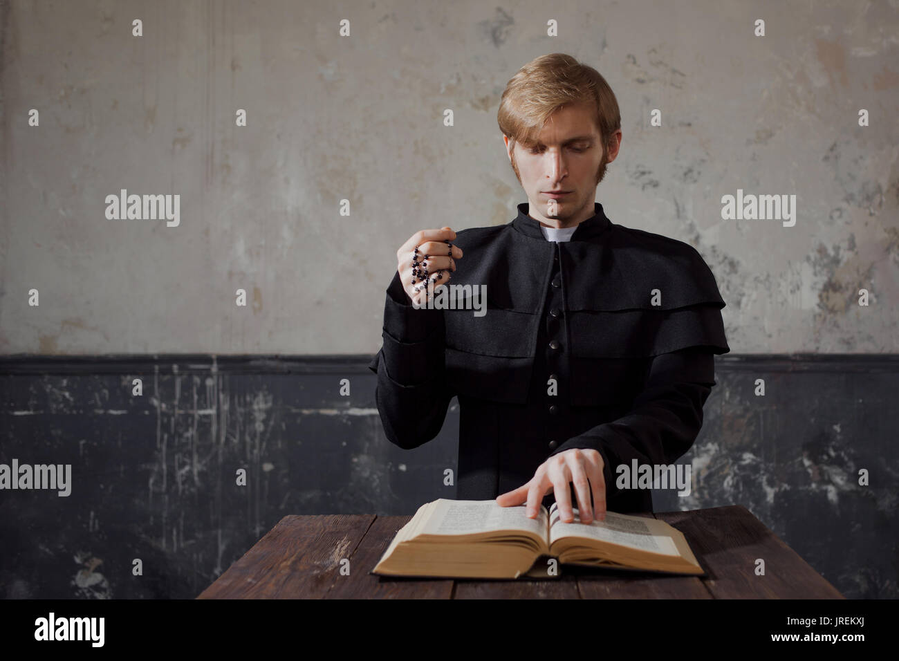 Portrait of handsome young catholic priest Stock Photo - Alamy