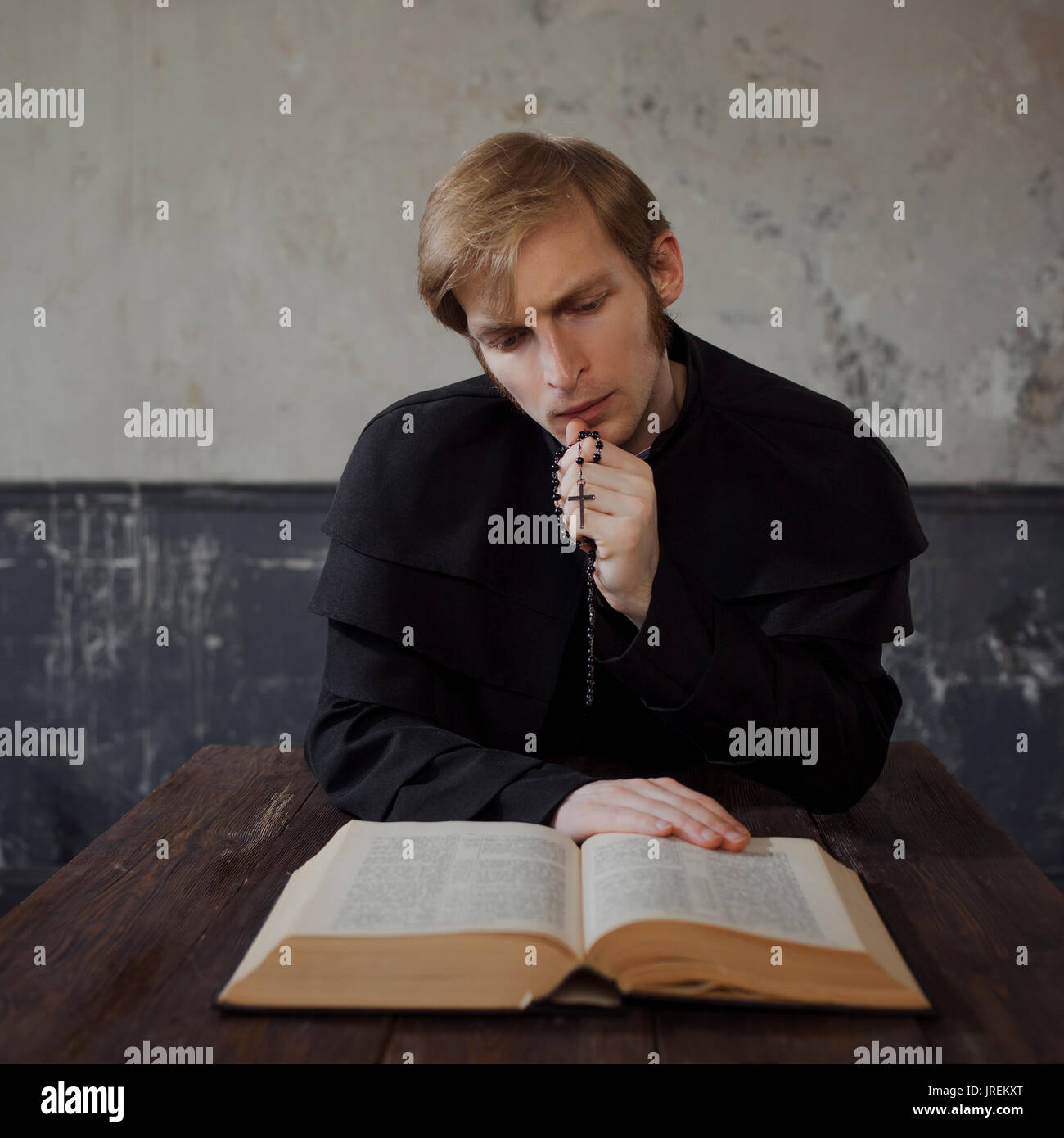 Portrait of handsome young catholic priest Stock Photo - Alamy