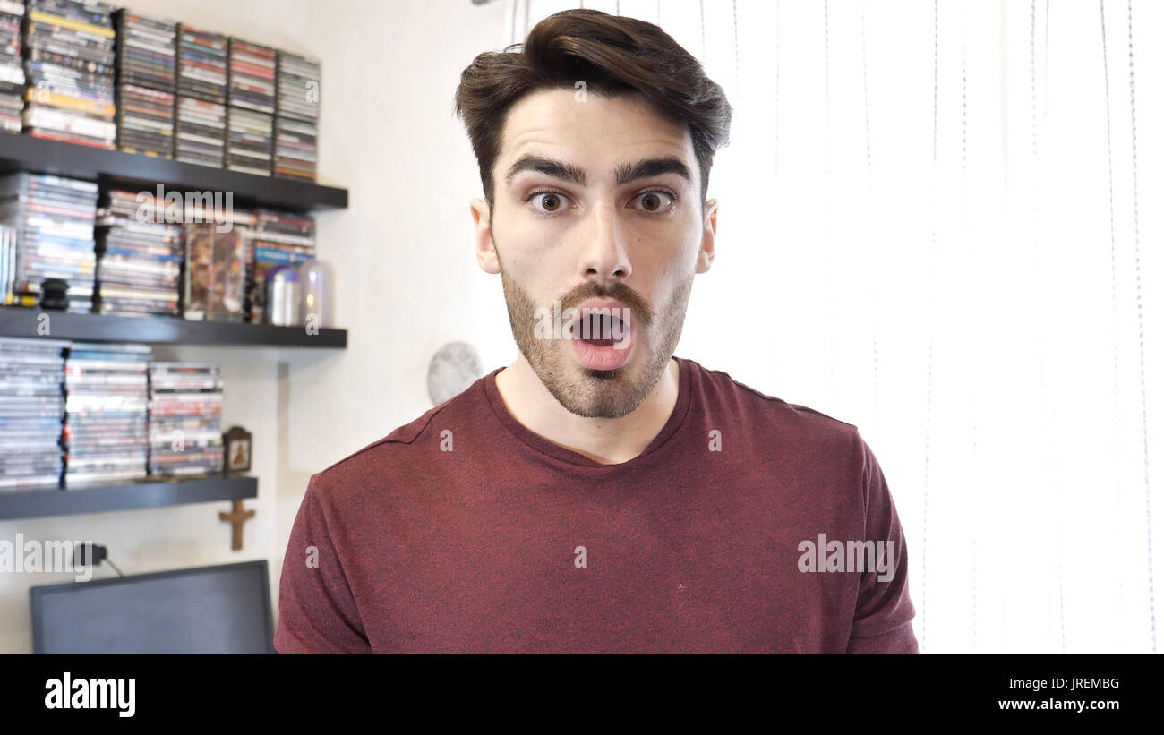 Surprised, shocked young man looking at camera Stock Photo - Alamy