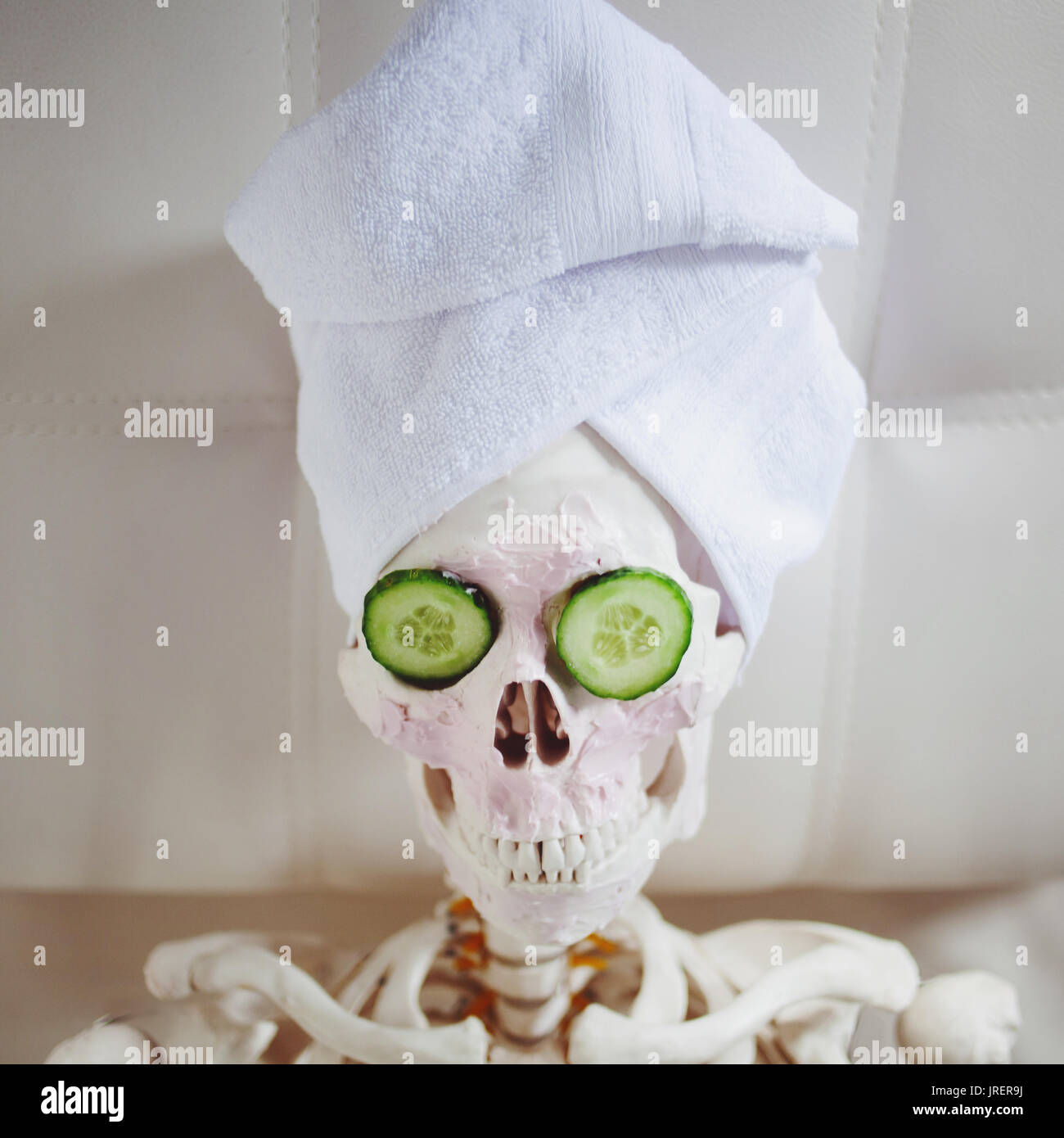 Skeleton in Spa salon with towel on her head and mask on her face ...