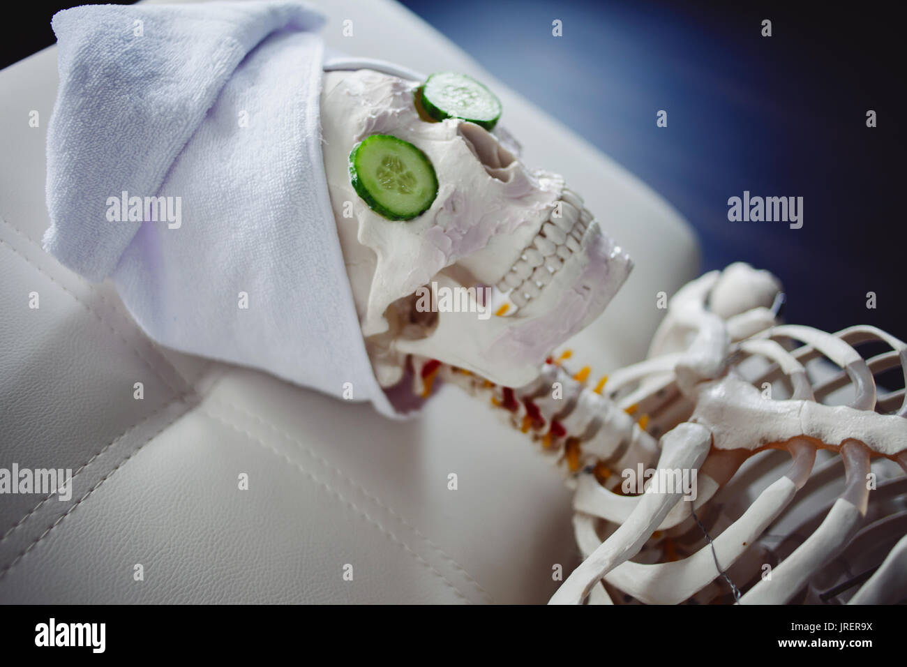 Skeleton in Spa salon with towel on her head and mask on her face ...